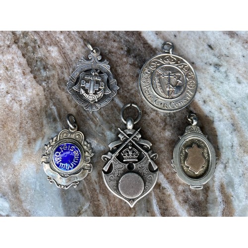 A collection of 5 antique Sterling Silver fobs.