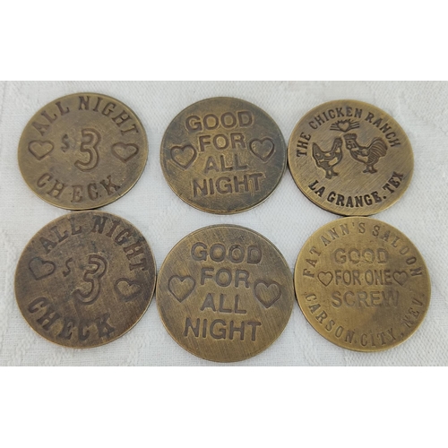 A collection of 6 vintage novelty tokens.