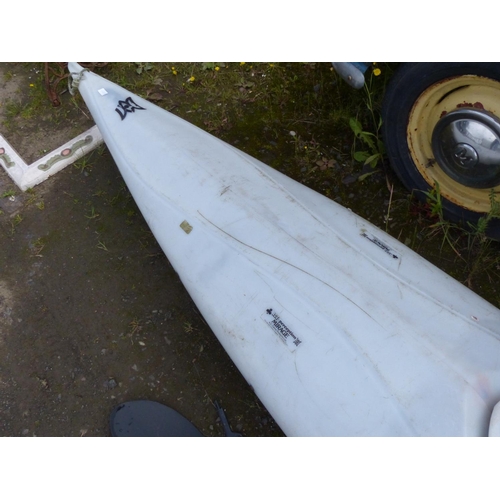 An Age Perception Mirage Canoe/ kayak with paddle.