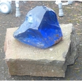 A large piece of blue slag glass & basalt.