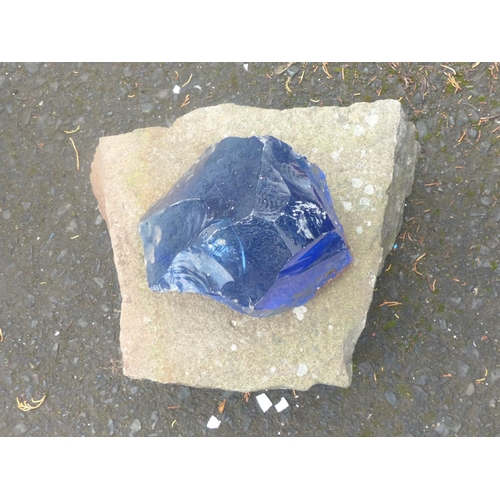 A large piece of blue slag glass & basalt.