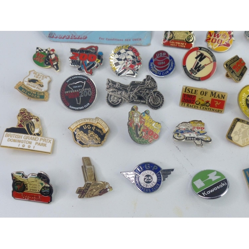 A collection of motorbike racing badges to include a Silverstone 1986 ...