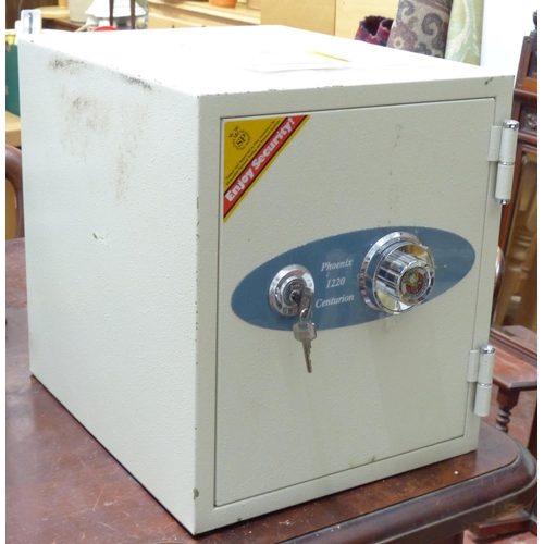 A Phoenix 1220 centurion safe, with key and combination.