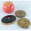 Three vintage powder compacts.