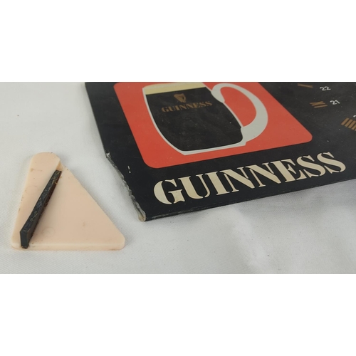 A vintage Guinness advertising clock (a/f).