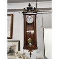 A stunning antique mahogany spring Vienna wall clock.