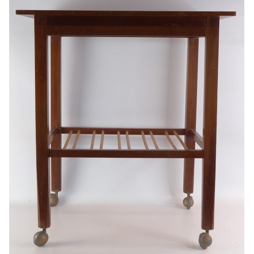 A Mid Century table with undershelf.