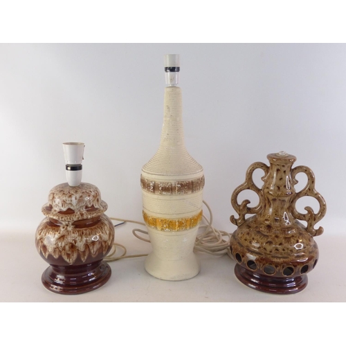 Two vintage table lamp bases and another.