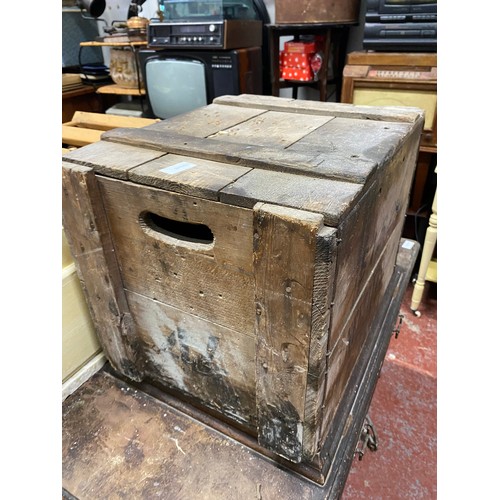 An antique wooden bottle crate 'Needlers Ltd, Hull'.
