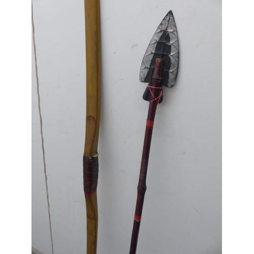 A vintage large Slazenger's hand painted wooden bow and arrow.