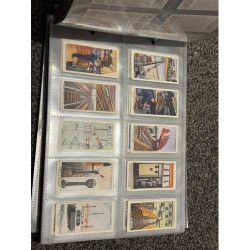 A BINDER OF TRANSPORT AND RAILWAYS RELATED CIGARETTE CARDS INCLUDING ...