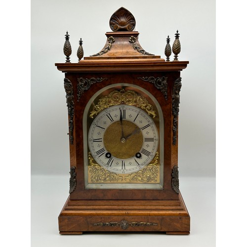 BURR WALNUT CASED CHIMING MANTEL CLOCK WITH GILT METAL MOUNTS AND FINIALS