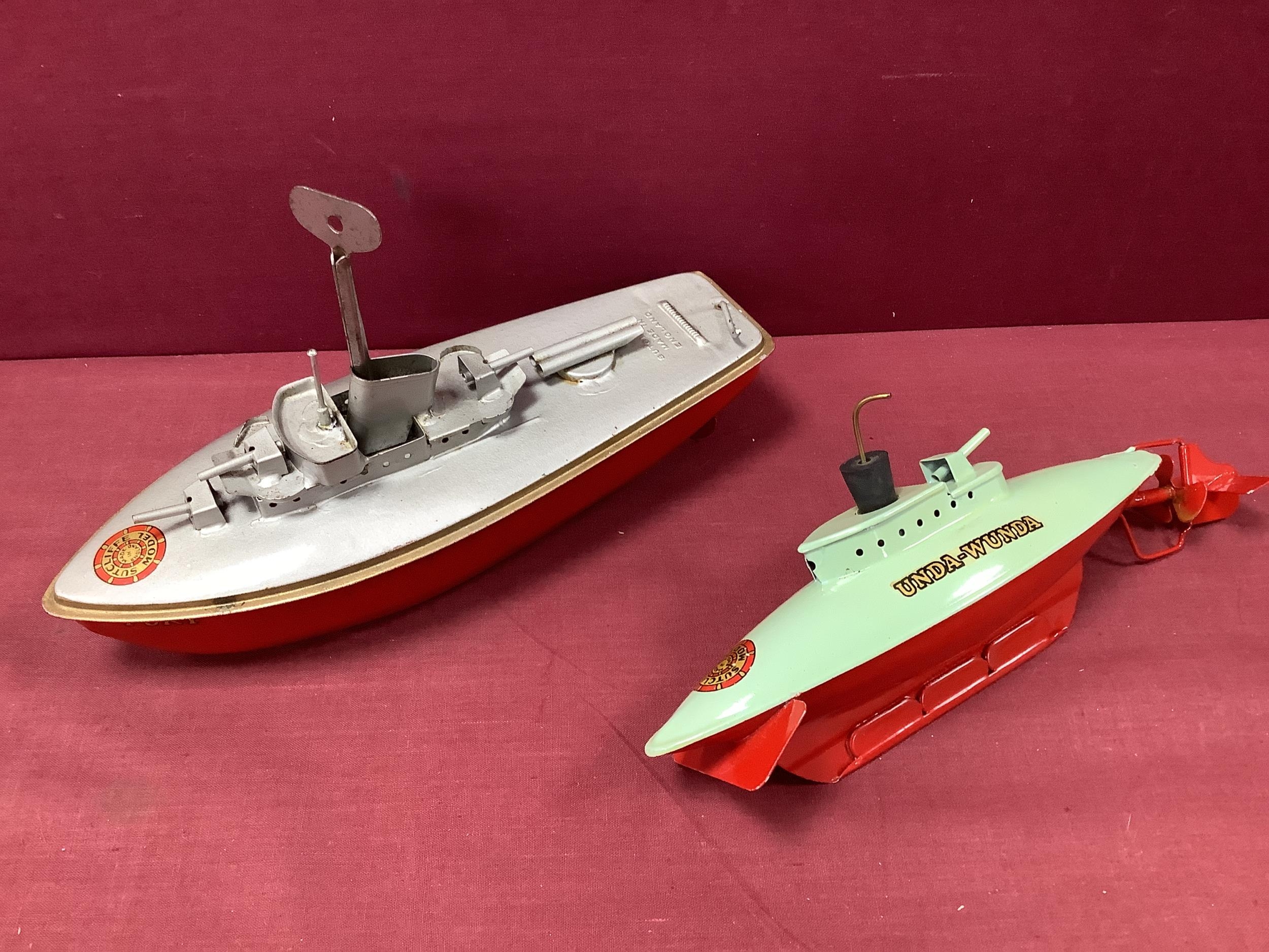 Two Sutcliffe Tinplate Clockwork Boats, Battleship 'Fury' and 'Unda ...