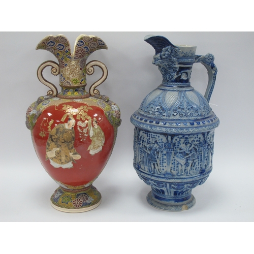 A Large German Pottery Ewer with mask handle, figural handle (repaired ...