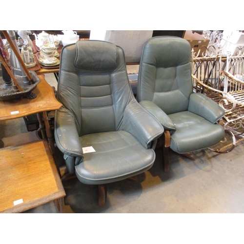 Two Revolving Lounge Chairs