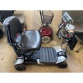 An Easy Living mobility scooter with key and charger and an Easy Living ...
