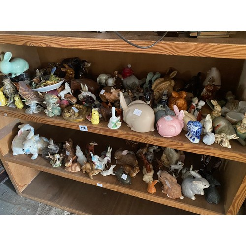 An extensive selection of pottery models of animals including rabbits ...