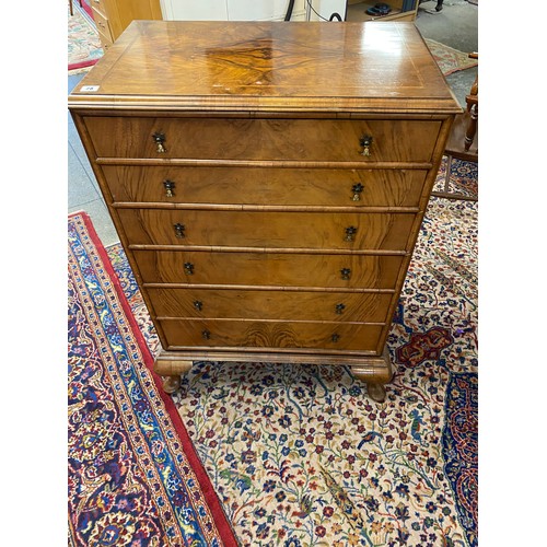 A walnut straight front chest fitted six drawers, on cabriole legs ...