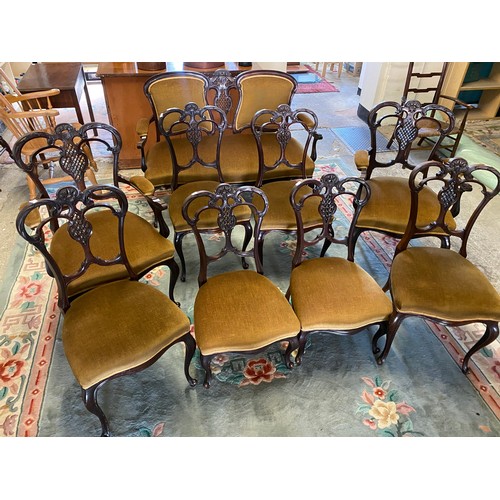 An Edwardian mahogany drawing room suite with scroll backs, pierced ...
