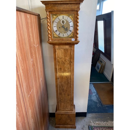 A reproduction longcase clock with brass dial, pierced spandrels ...