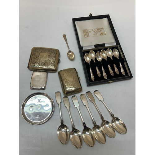 A plain silver circular pin tray, two curved silver plated cigarette ...