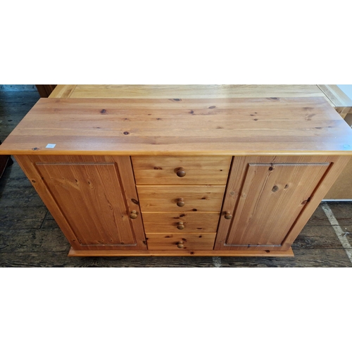 Modern pine rectangular sideboard with central bank of four drawers ...