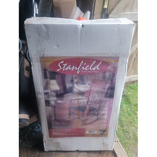 A pair of flat pack rocking chairs - unopened for assembly. lot = 2 ...