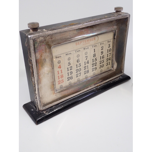 A silver mounted calendar