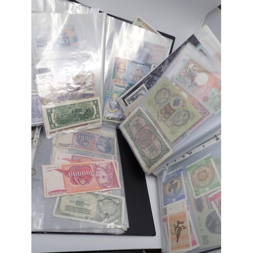 Three folders of bank notes