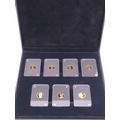 A boxed set of 7 gold coins 1/25 crowns (Seven Signatories)