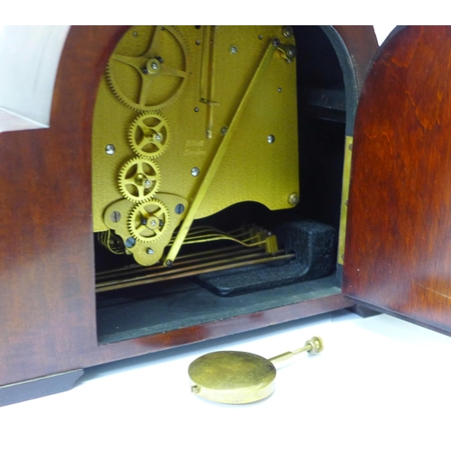 An Elliott mantel clock with chiming movement, the dial marked Cope ...