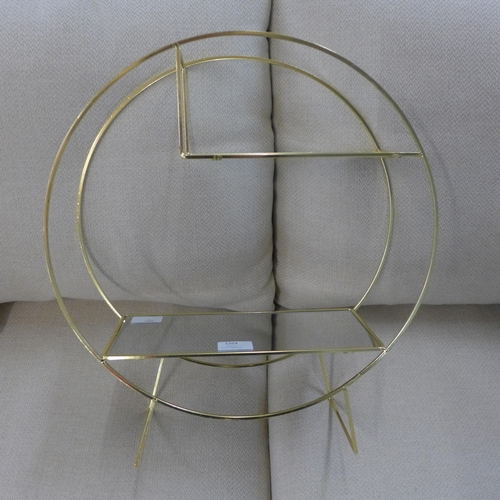 A gold display unit with bevelled mirror shelves (WF245310)