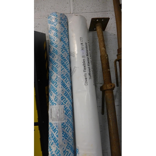 Two rolls of tufted flame retardant plastic sheet