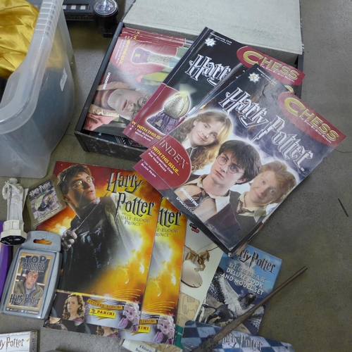 A collection of Harry Potter items including figures, Top Trumps cards ...