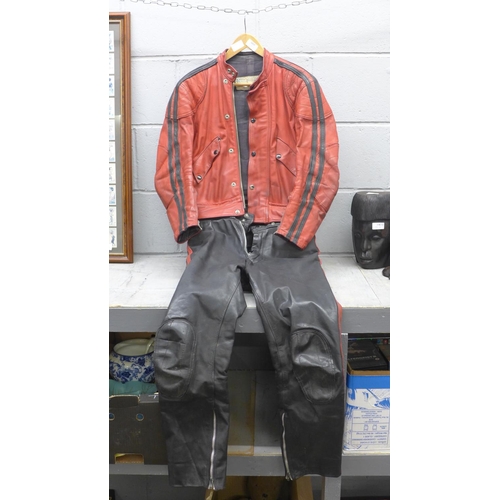 A Reg Cross Racing Clothing two piece leather motorcycle racing suit ...