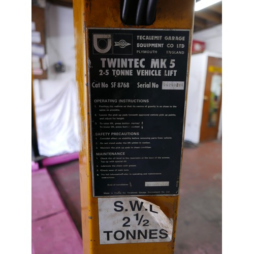 A Tecalemit Twintec MK5 2.5 tonne two-post automotive vehicle lift, cat ...