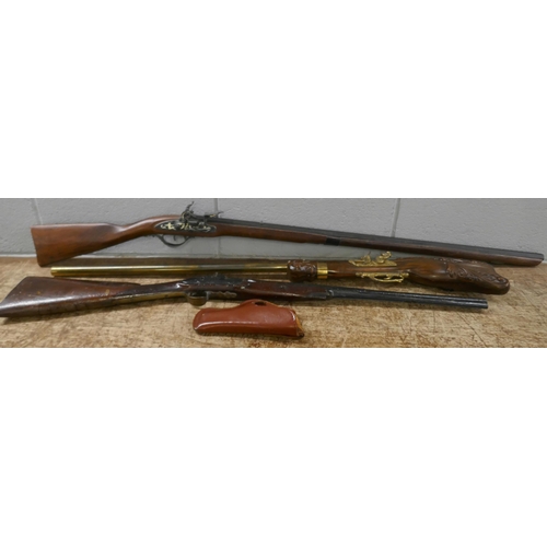 An ornate composite rifle, a flintlock rifle with brass butt, holster ...