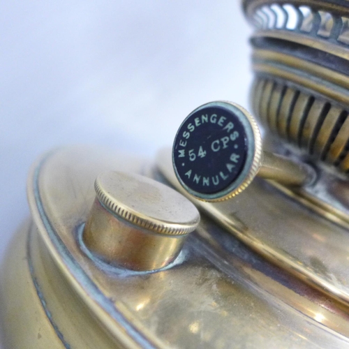 A Victorian brass messenger oil lamp with chimney and etched glass ...
