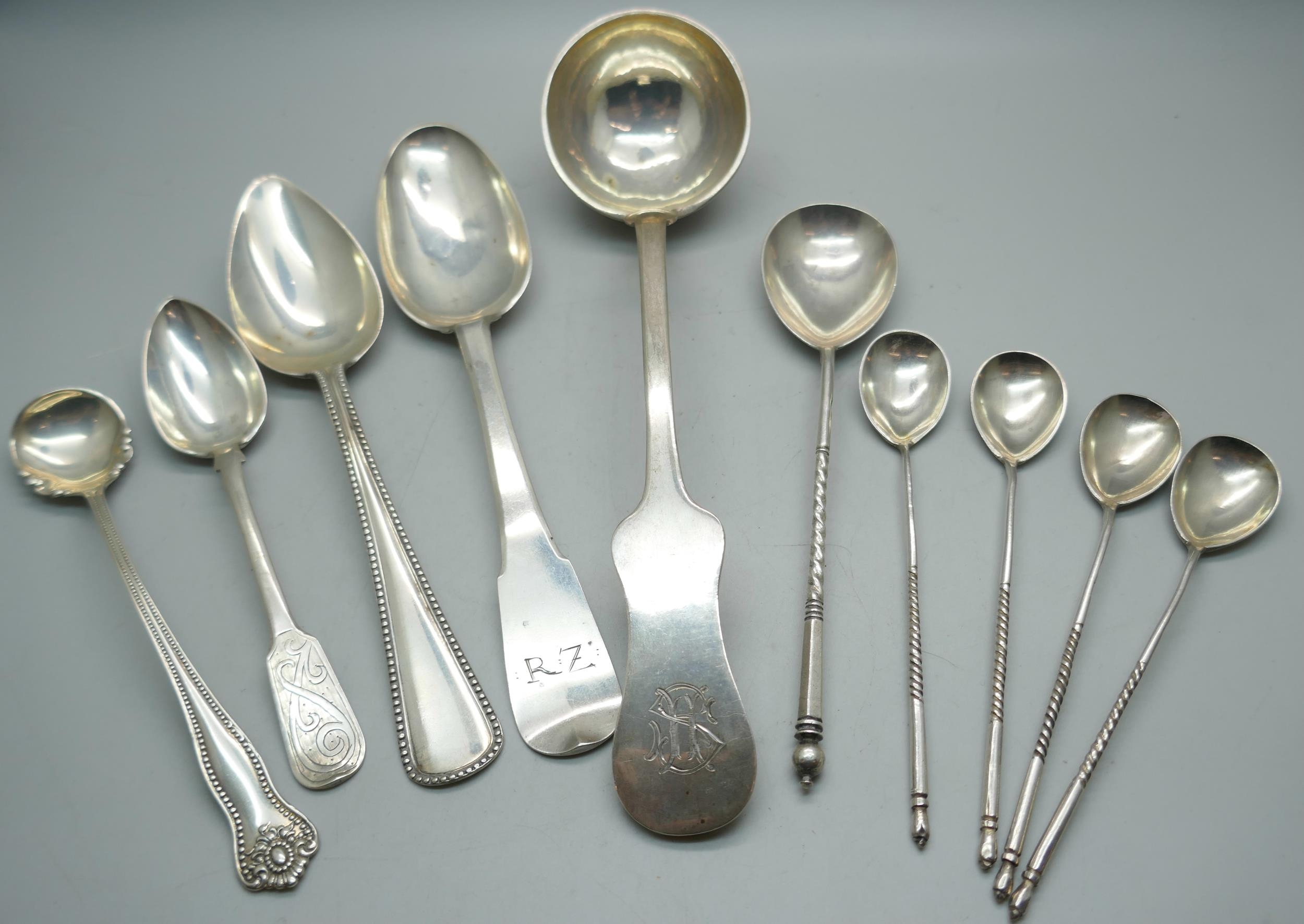 Nine spoons; ladle with continental control mark, two large spoons with ...