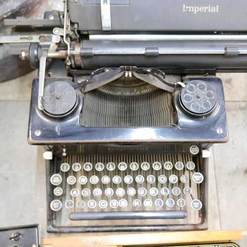 A Singer sewing machine and an Imperial typewriter