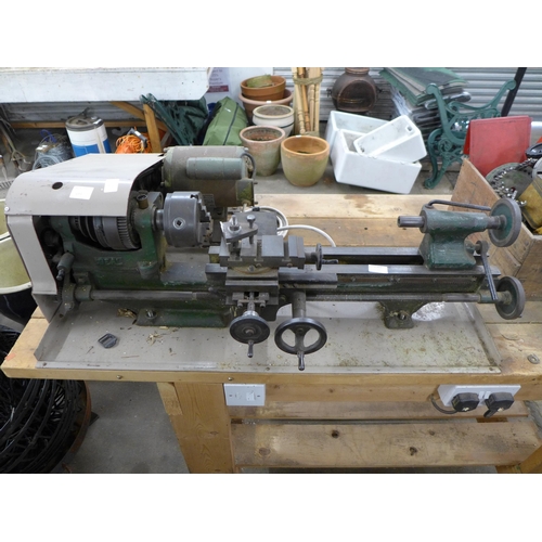 A vintage metal working lathe and a Kinzo 8E406 bench grinder mounted ...