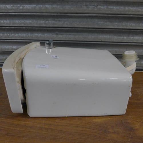 A small ceramic toilet cistern