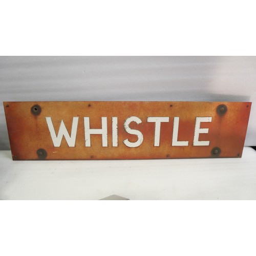 A railway whistle board sign. Embossed steel in weathered condition a ...