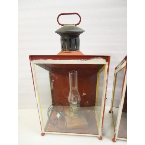 A pair of LMS/LNWR station platform lamps with reservoirs and glass ...