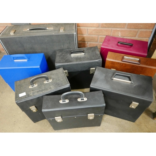 Seven record cases for vinyl LP records and a larger case which holds ...