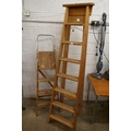 2 sets of wooden step ladders - an 8 rung and a 5 rung