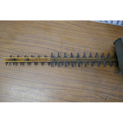 A Ryobi RHT2660DA petrol driven hedge trimmer and a McCulloch Gladiator ...