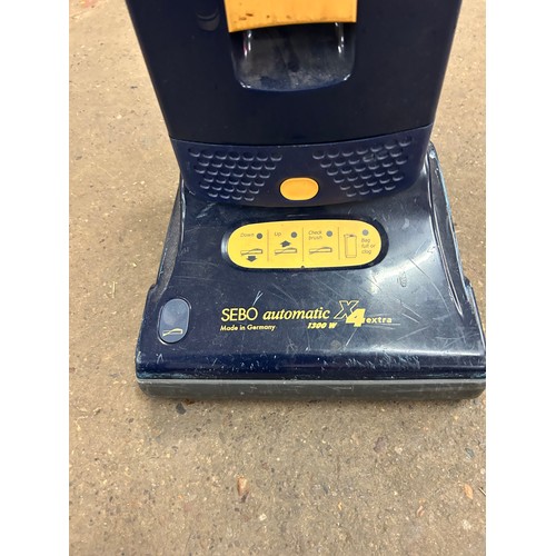 A Sebo X4 plus upright vacuum cleaner