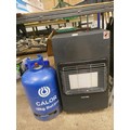 A Calor gas fire with gas bottle (faulty)