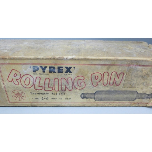 A T.G. Green 'milk' jug and one other jug and a Pyrex glass rolling pin